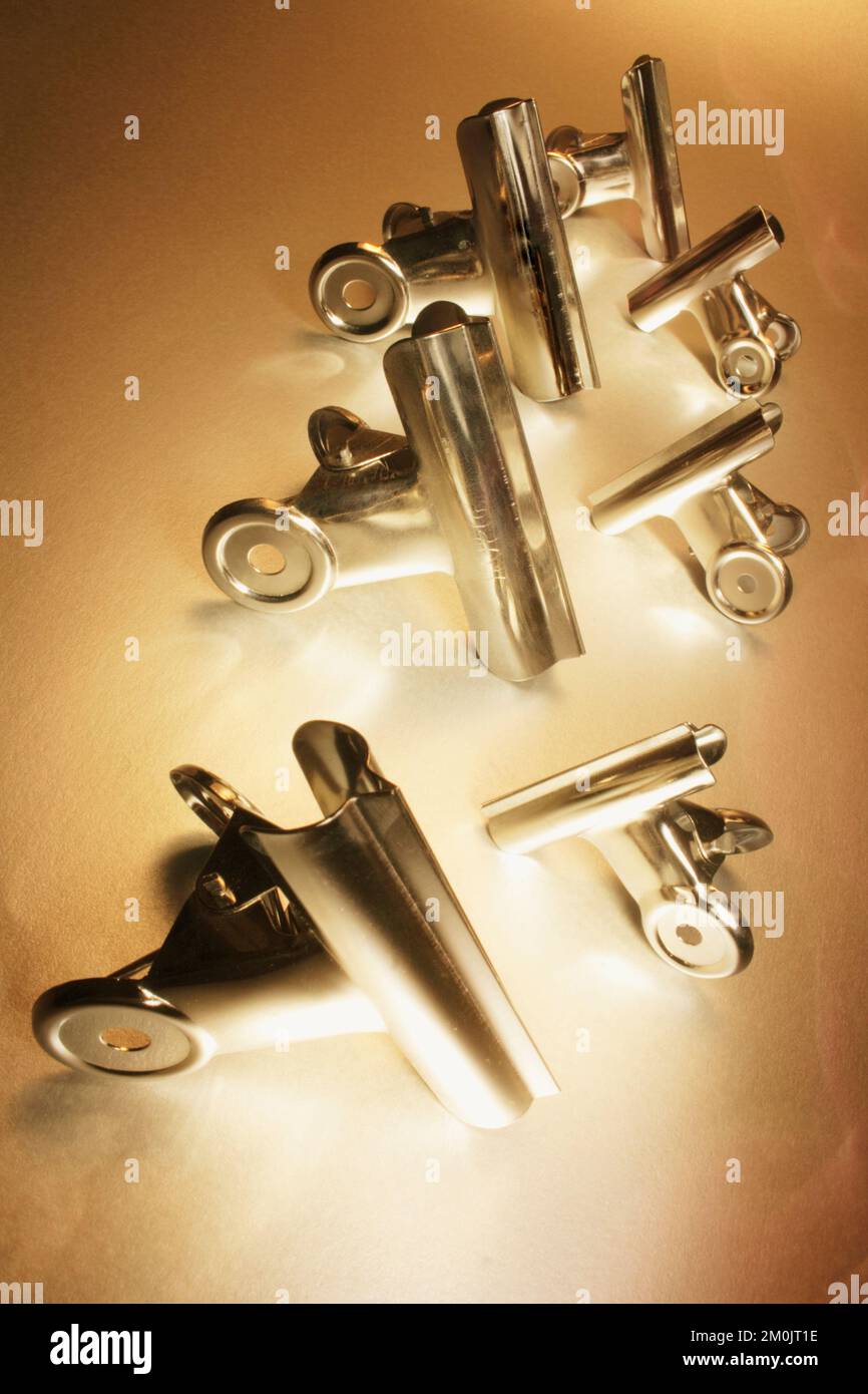 Bulldog Clips on Warm Background Stock Photo - Alamy