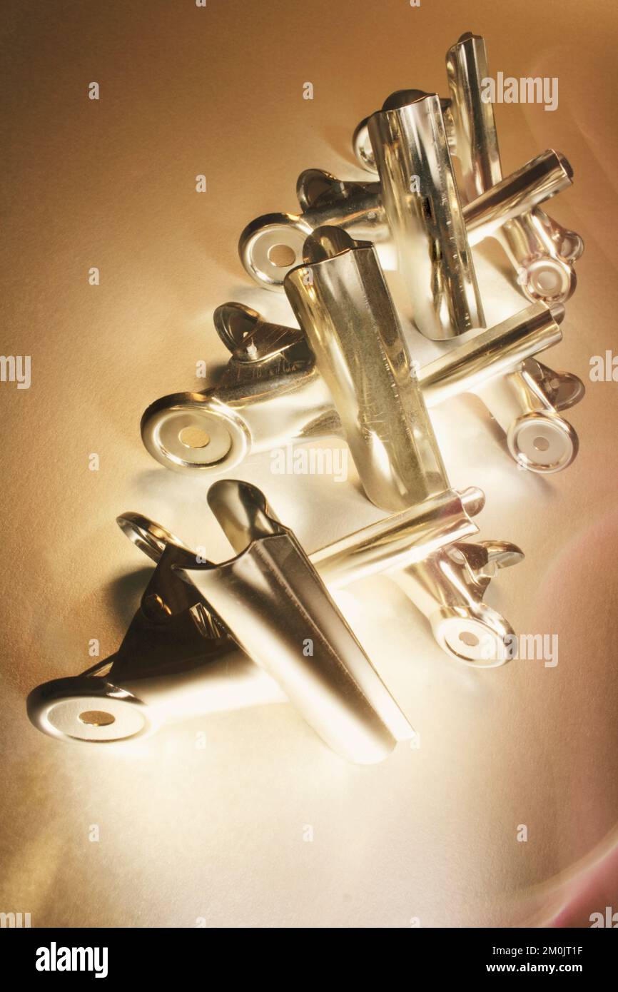Bulldog Clips on Warm Background Stock Photo - Alamy