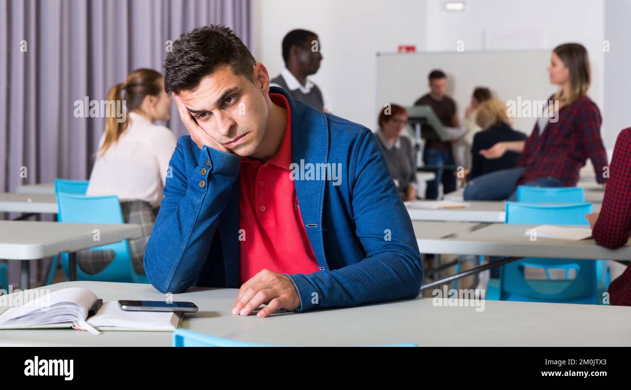 Unhappy guy in class Stock Photo - Alamy