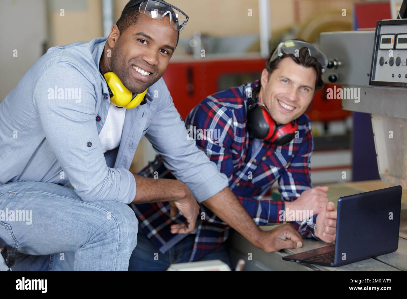 Two men turning valve hi-res stock photography and images - Alamy