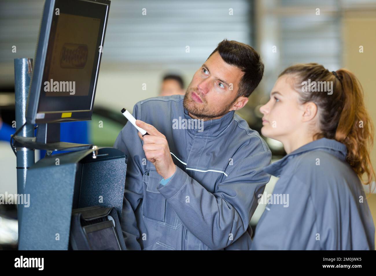 reefer container technician is monitoring temperature by using laptop ...