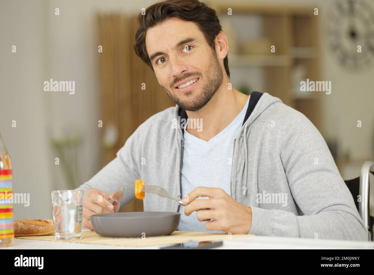 happy man eating lunch Stock Photo - Alamy