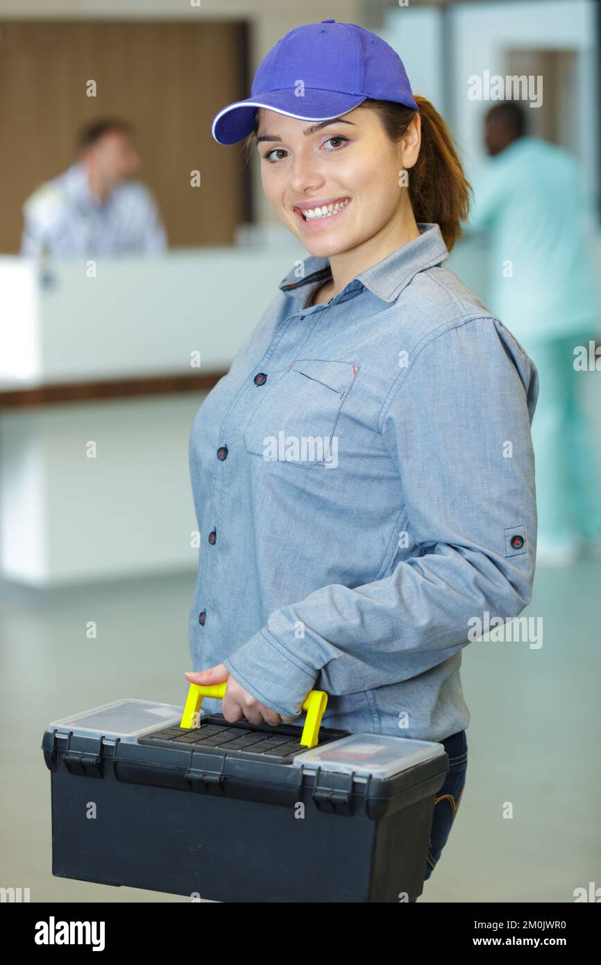 a smiling woman with toolbox Stock Photo - Alamy