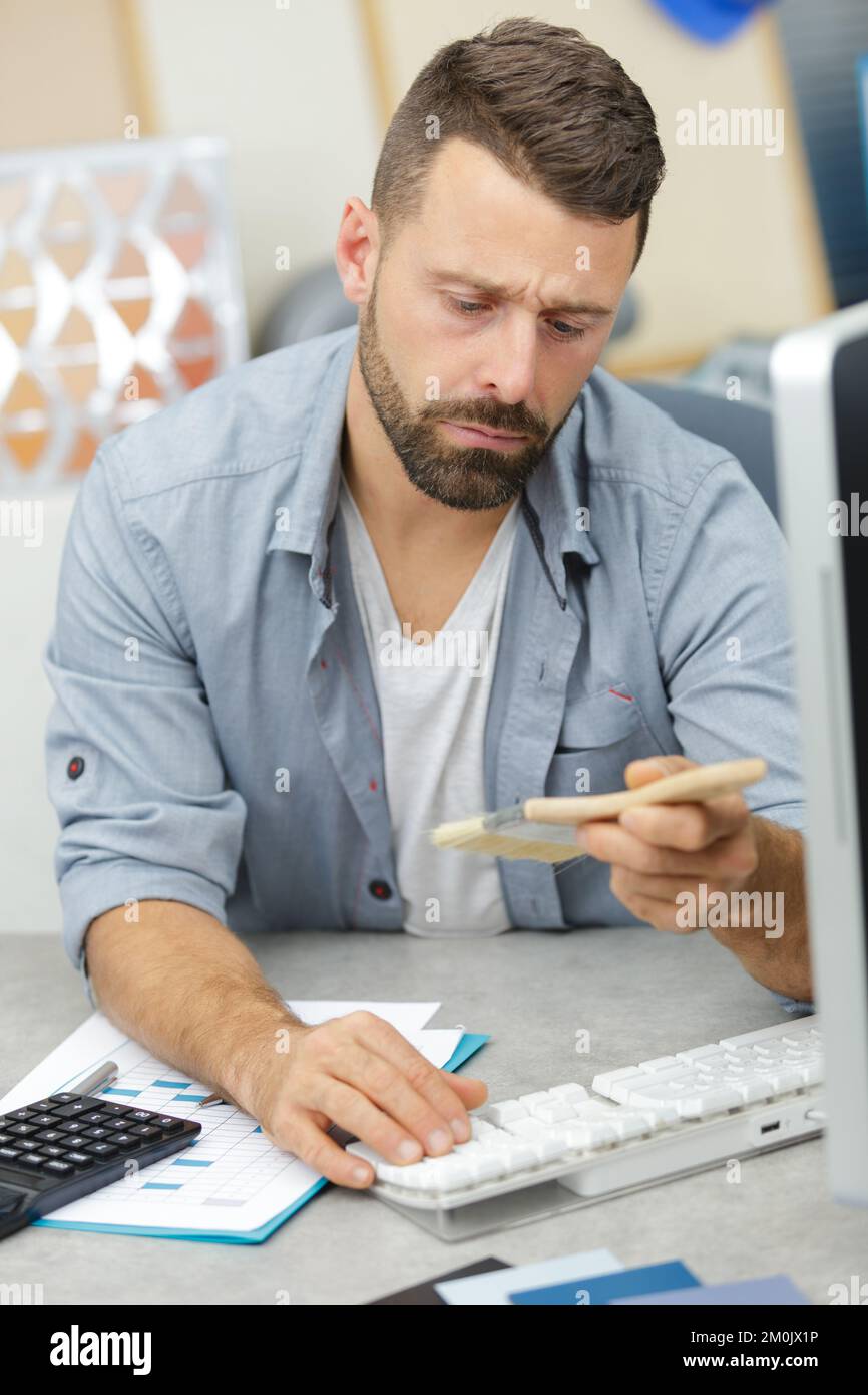 a foreman checking brush price Stock Photo - Alamy