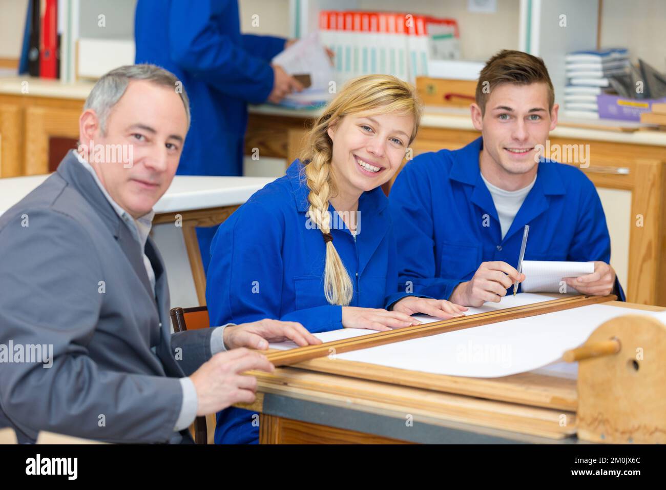 apprentice posing together with their teacher Stock Photo - Alamy