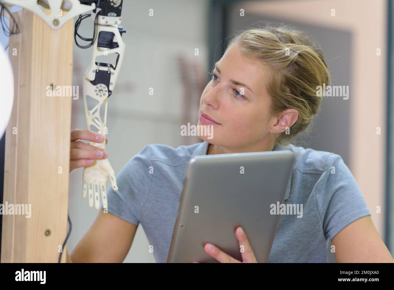 students of technology working using a robotic arm Stock Photo - Alamy