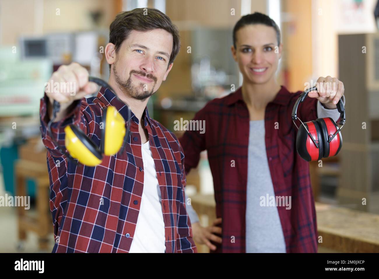 workers using ear protection at factory Stock Photo - Alamy