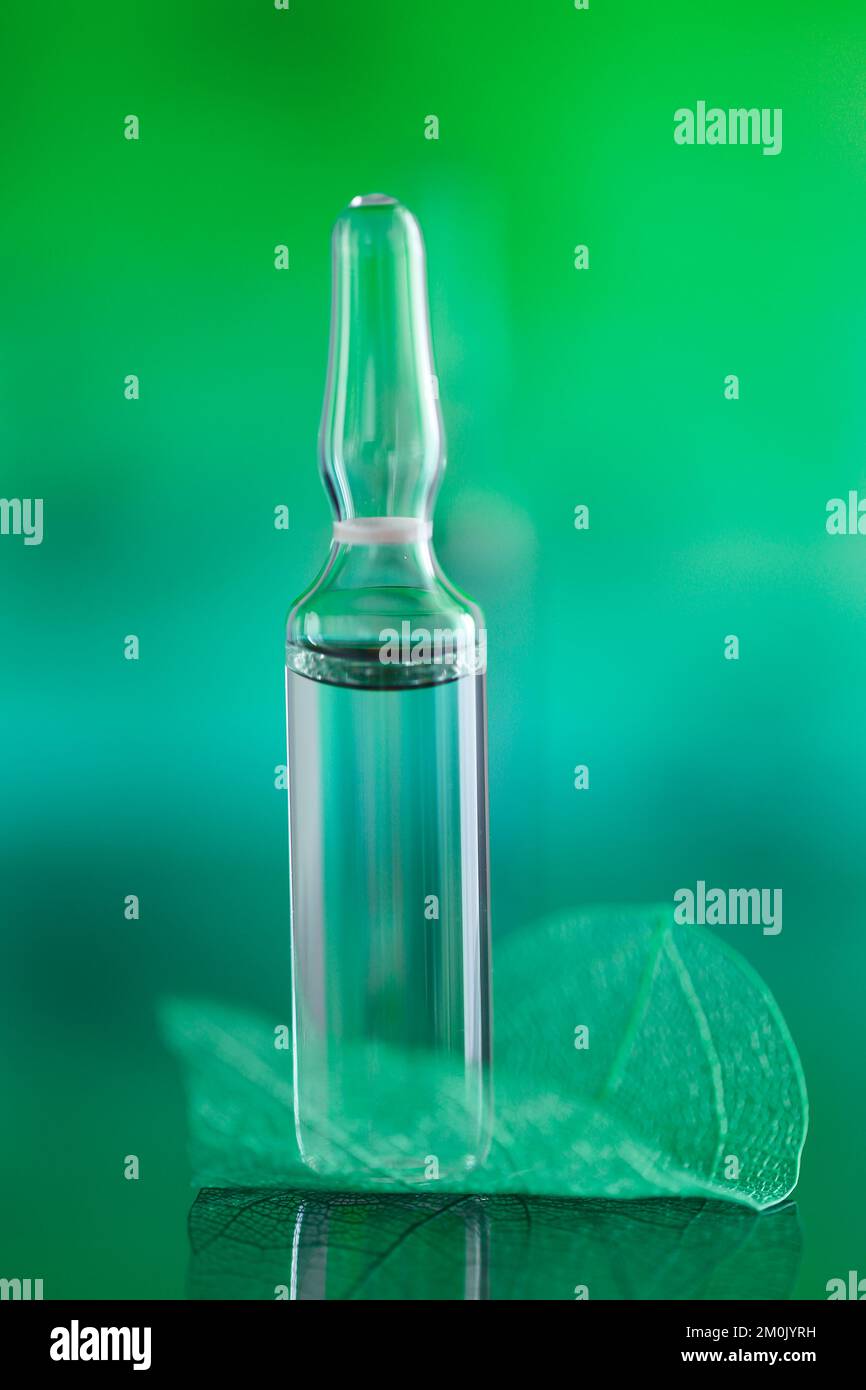 cosmetic ampoule.Beauty products.Transparent ampoule and skeletonized ...