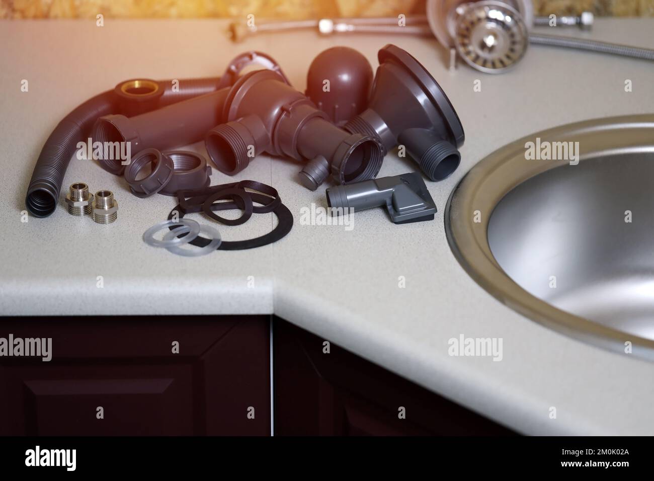 Plumbers tools and water tap ready for installation near sink on ...