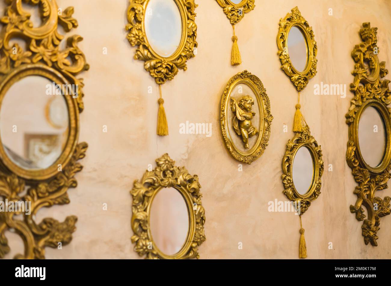 A selection of luxurious antique mirrors with gilded frames and ...
