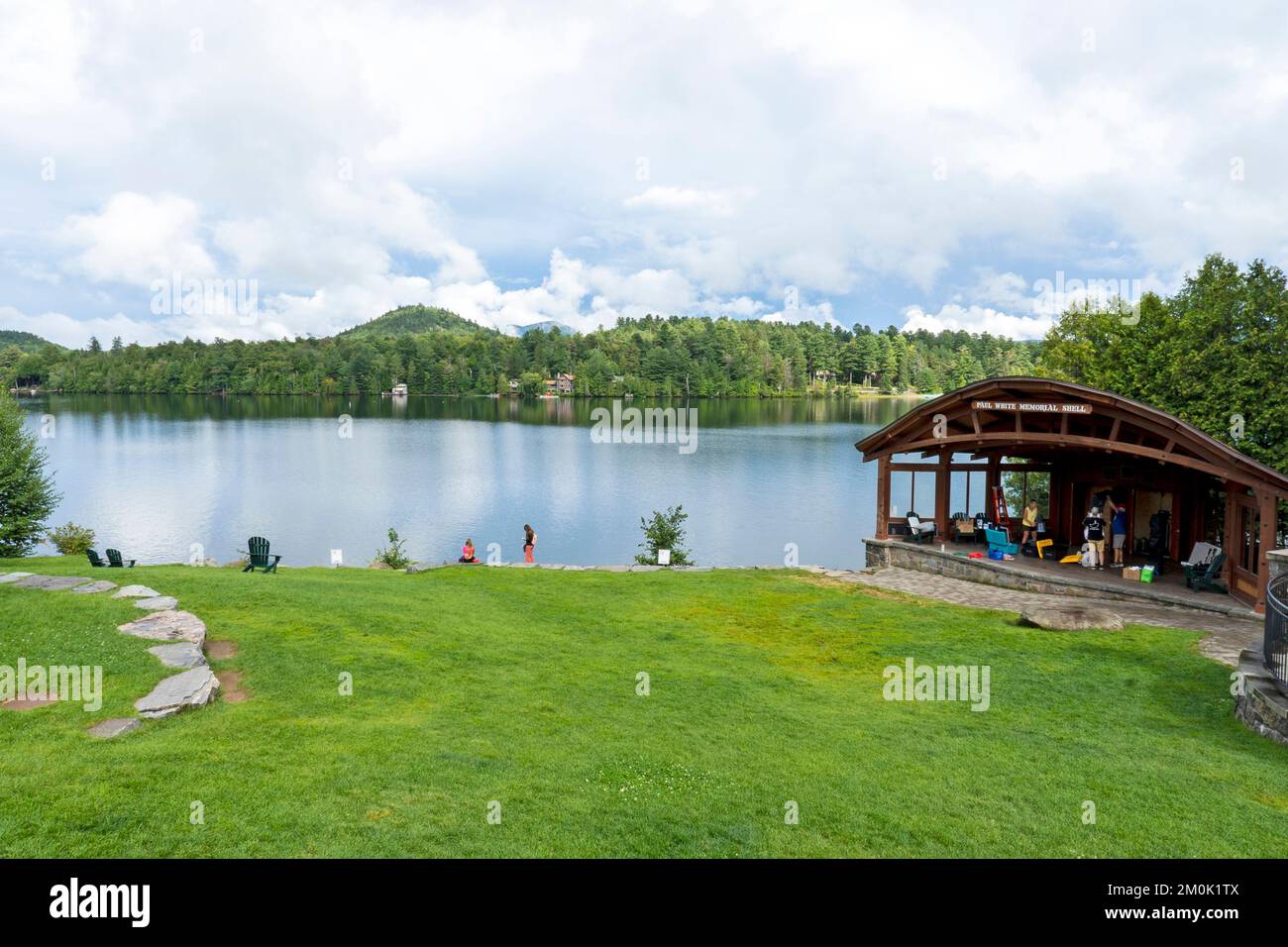 Tourists on lawn in front of Mirror Lake, view of the the Paul White ...