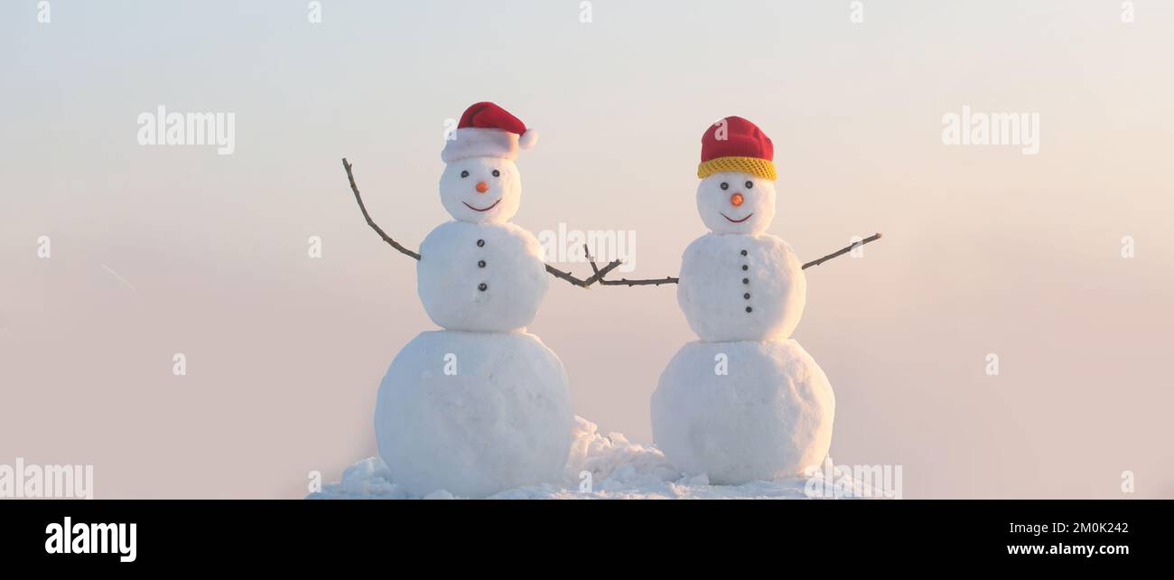 Snowman couple on the snow outdoor background. Christmas banner with ...