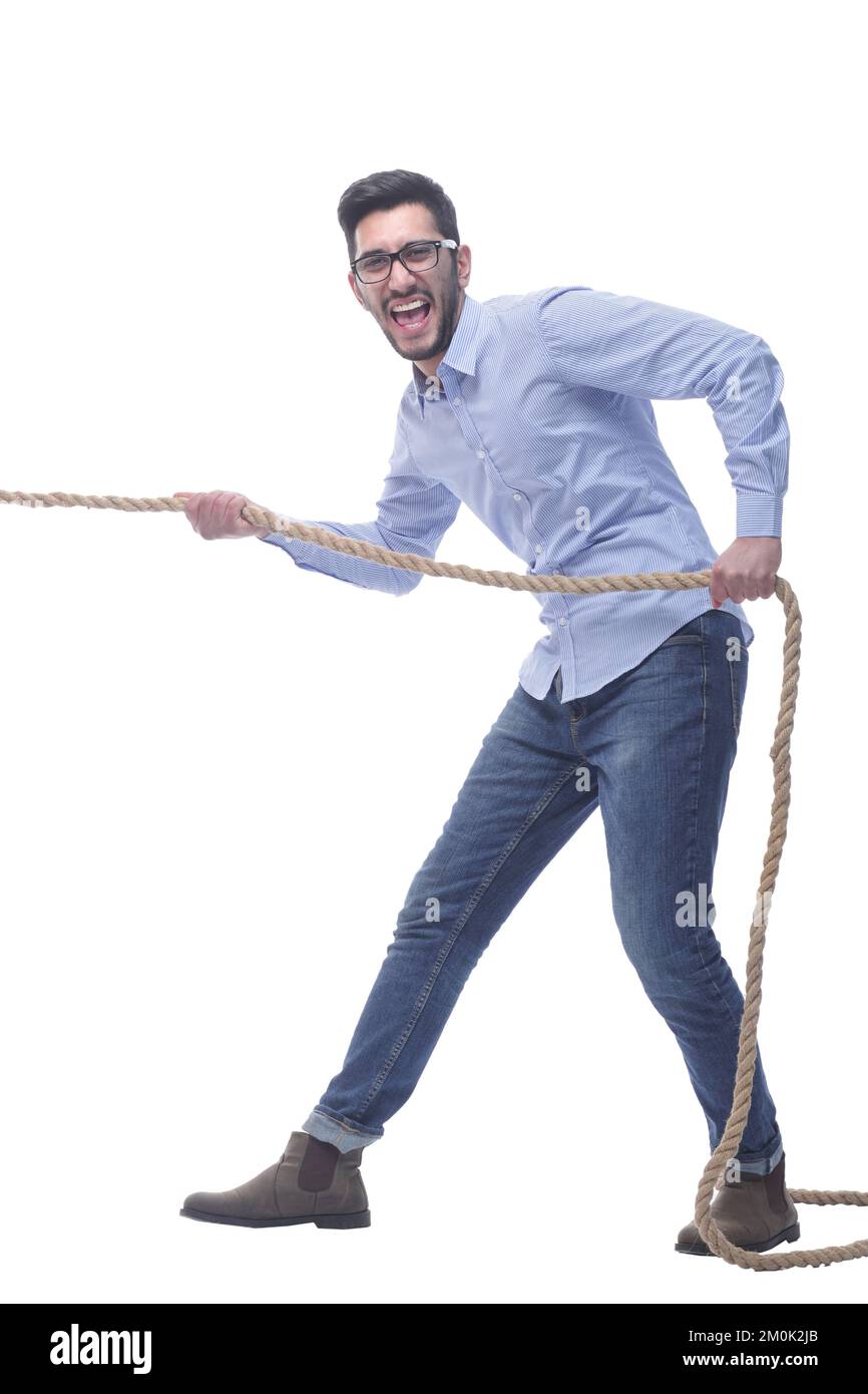 purposeful young man pulls the rope. isolated on a white background ...
