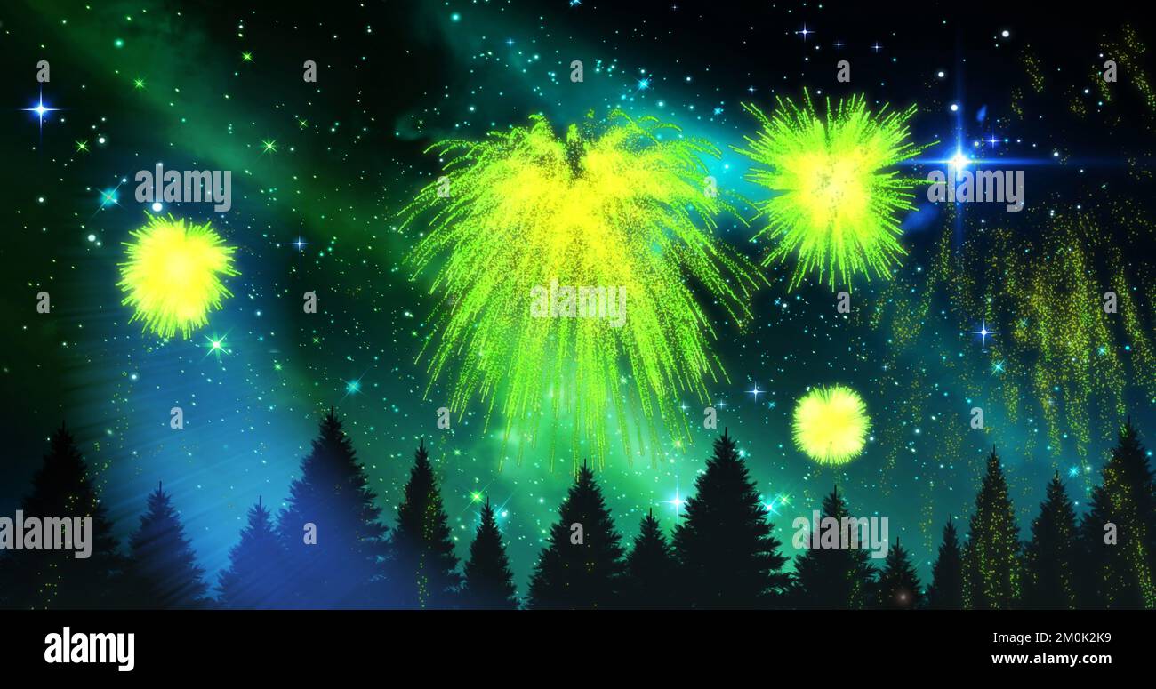 Image of green christmas and new year fireworks exploding over trees in ...