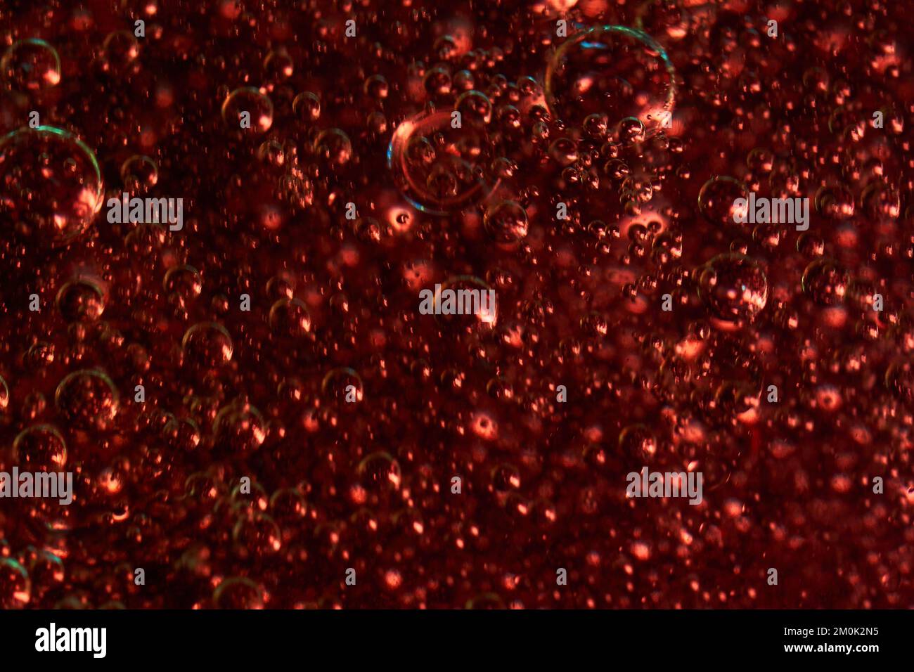 Red rising bubbles in different sizes from small to medium Stock Photo - Alamy