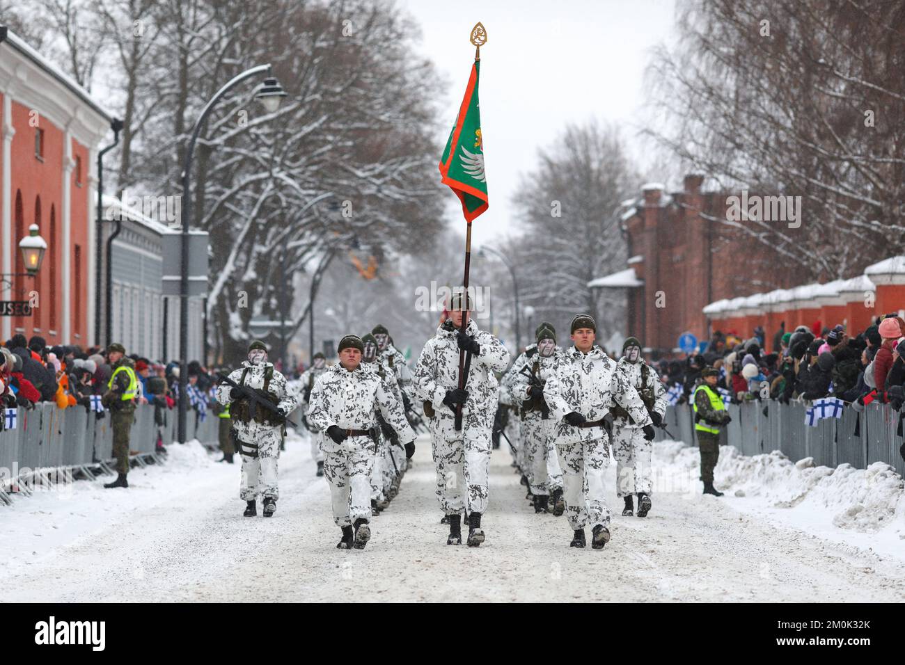 Soldiers of the Finnish Armed Forces march with a flag during the ...