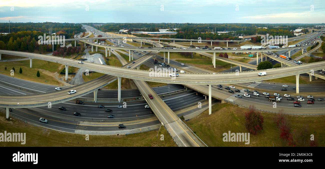 Aerial view of american freeway intersection with fast moving cars and ...