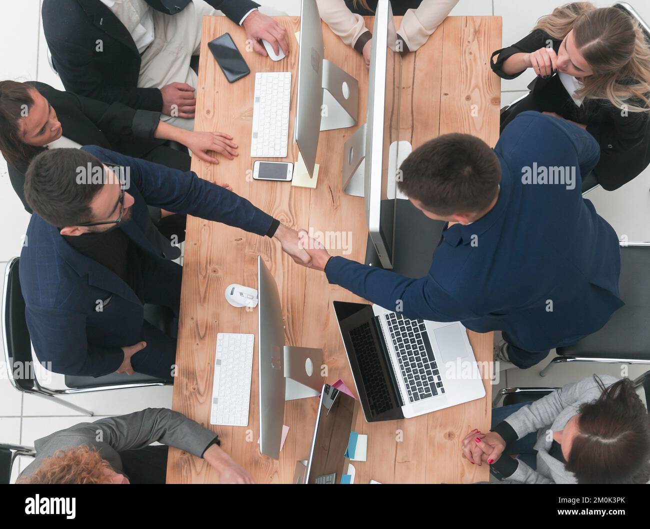 business colleagues supporting each other with a handshake Stock Photo ...