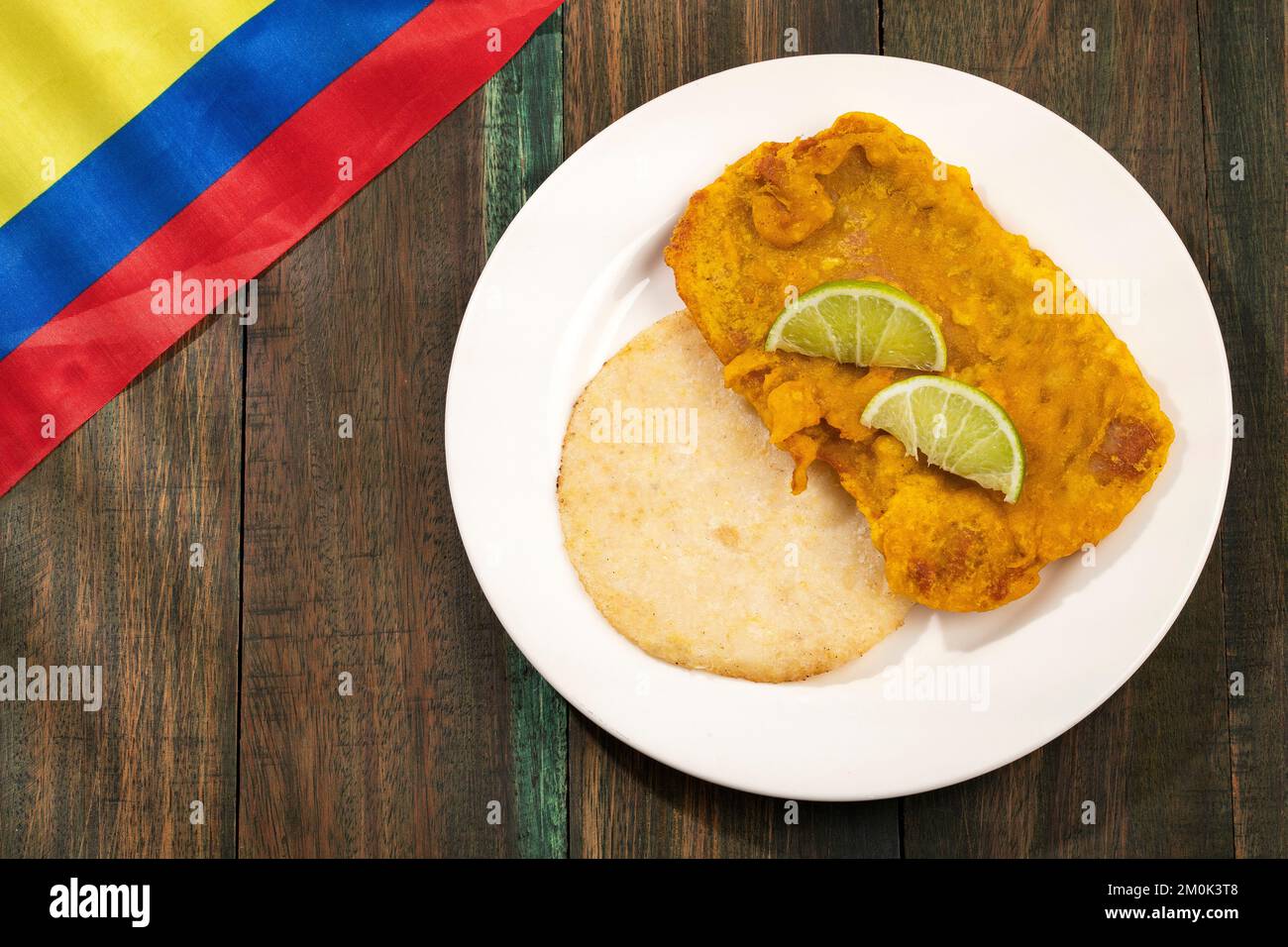 Breaded fish fillet - Traditional Colombian food Stock Photo - Alamy