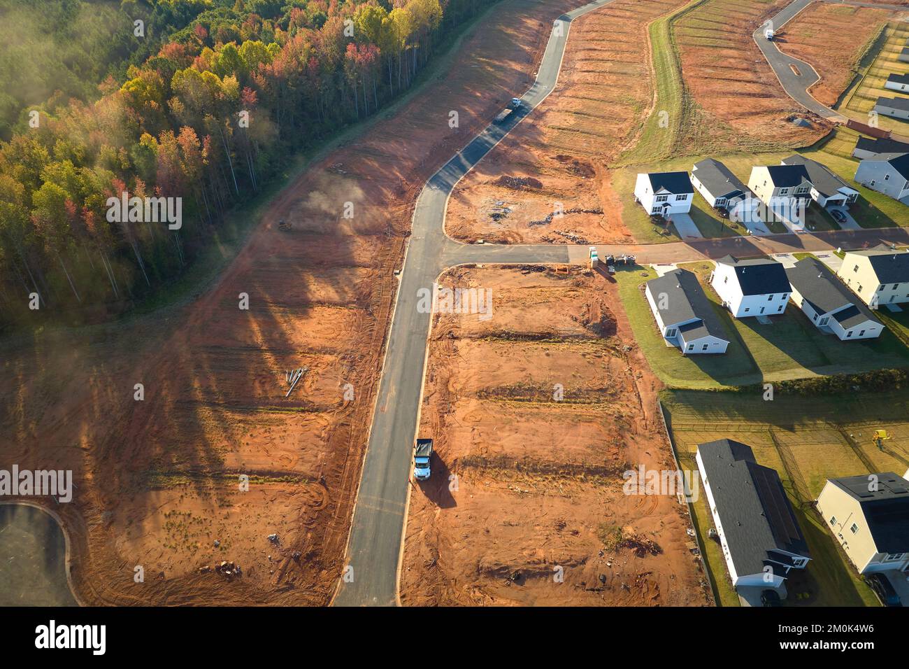 Aerial view of real estate development with tightly located family ...