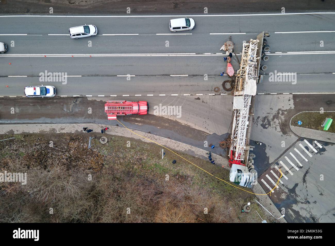 Aerial view of road accident with overturned truck blocking traffic ...