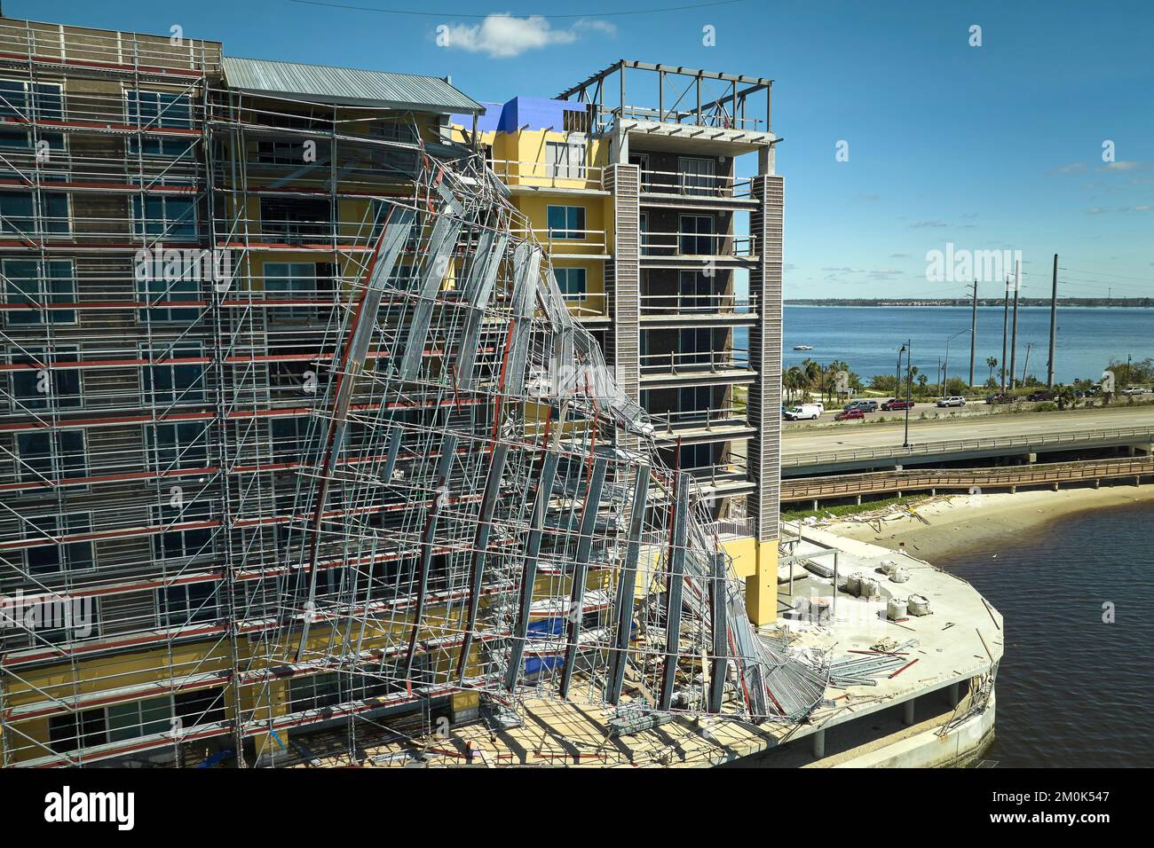 Aerial view of ruined by hurricane Ian construction scaffolding on high ...