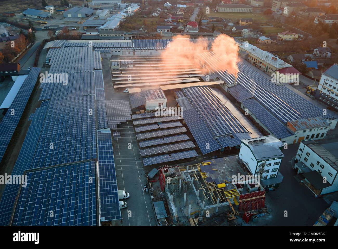 Aerial view of solar power plant with blue photovoltaic panels mounted ...