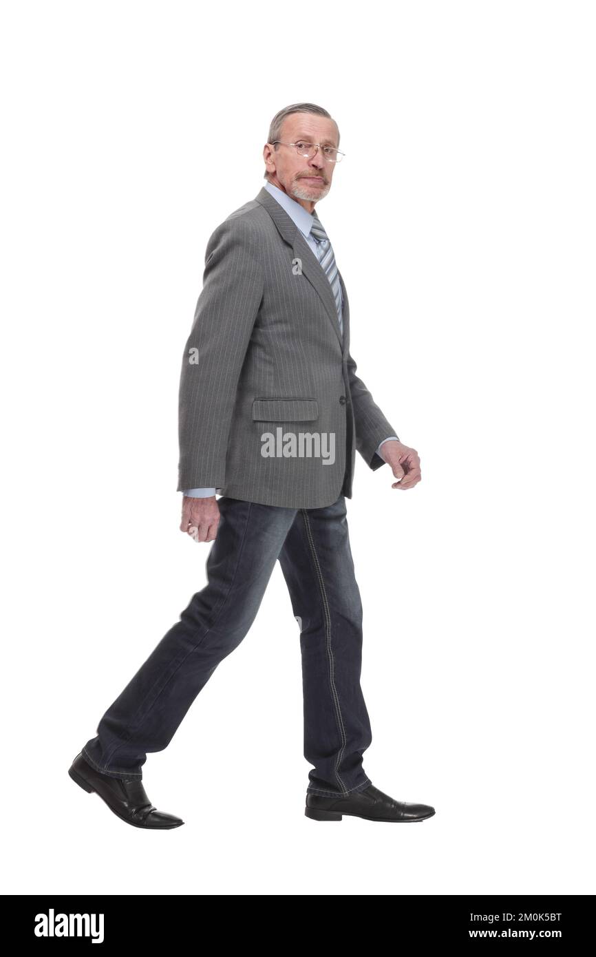 side view full length photo of a mid aged business man walking forward ...