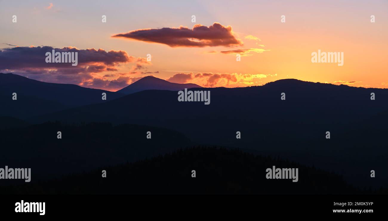 Beautiful evening panoramic landscape with bright setting sun over ...