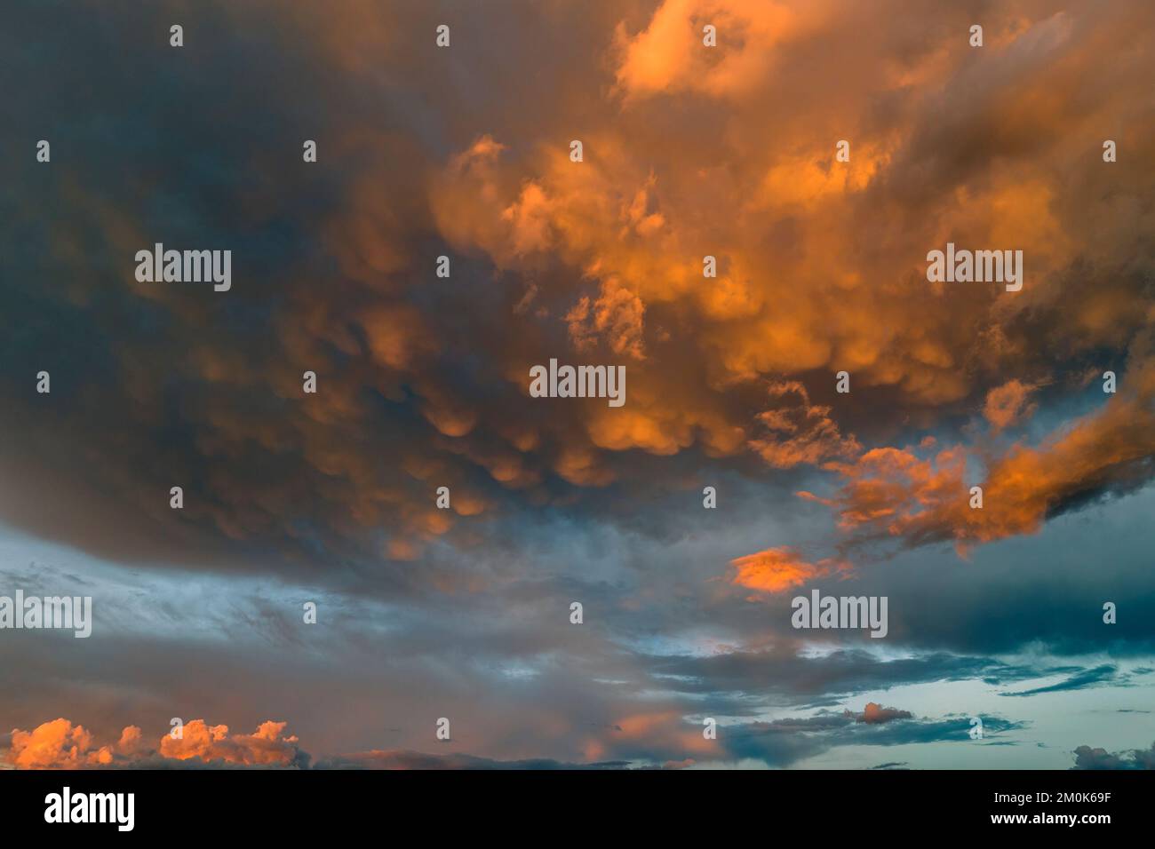 Cumulonimbus clouds forming before thunderstorm on evening sky ...