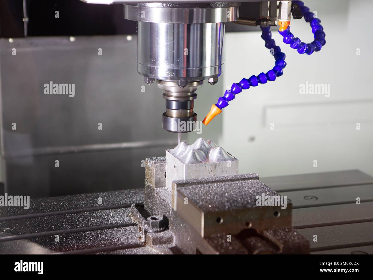 High precision CNC milling machine cutting plastic workpiece ...