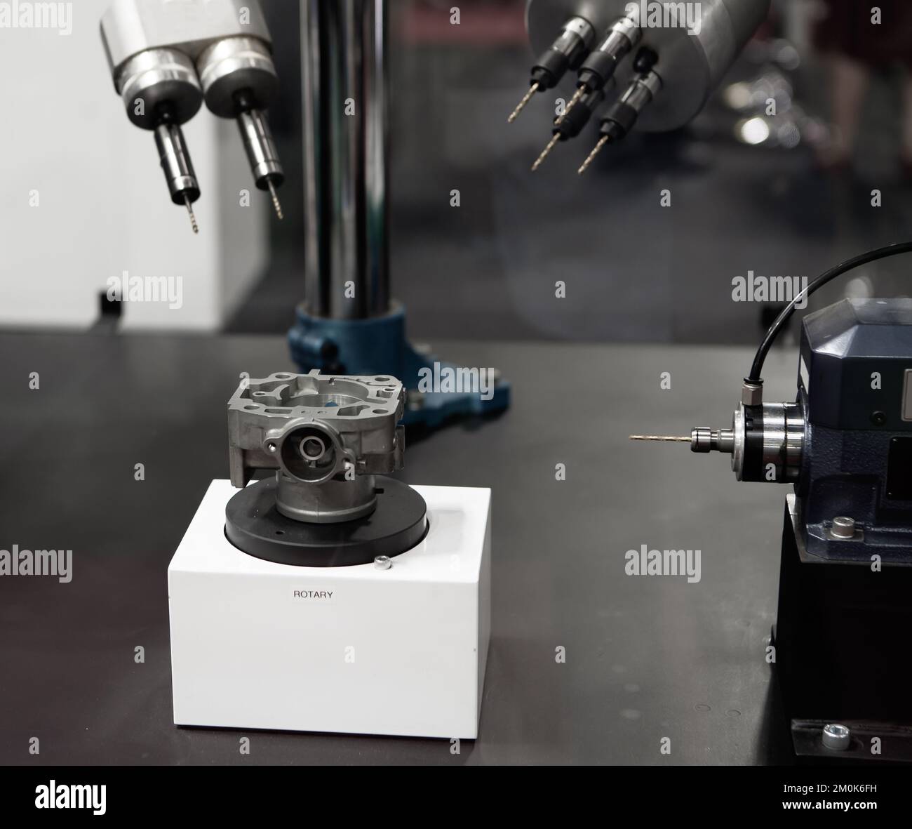 CNC multi spindle rotary drilling workpiece. Industrial manufacture ...