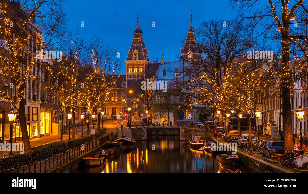 Christmas in Amsterdam canals with Christmas lights during December ...