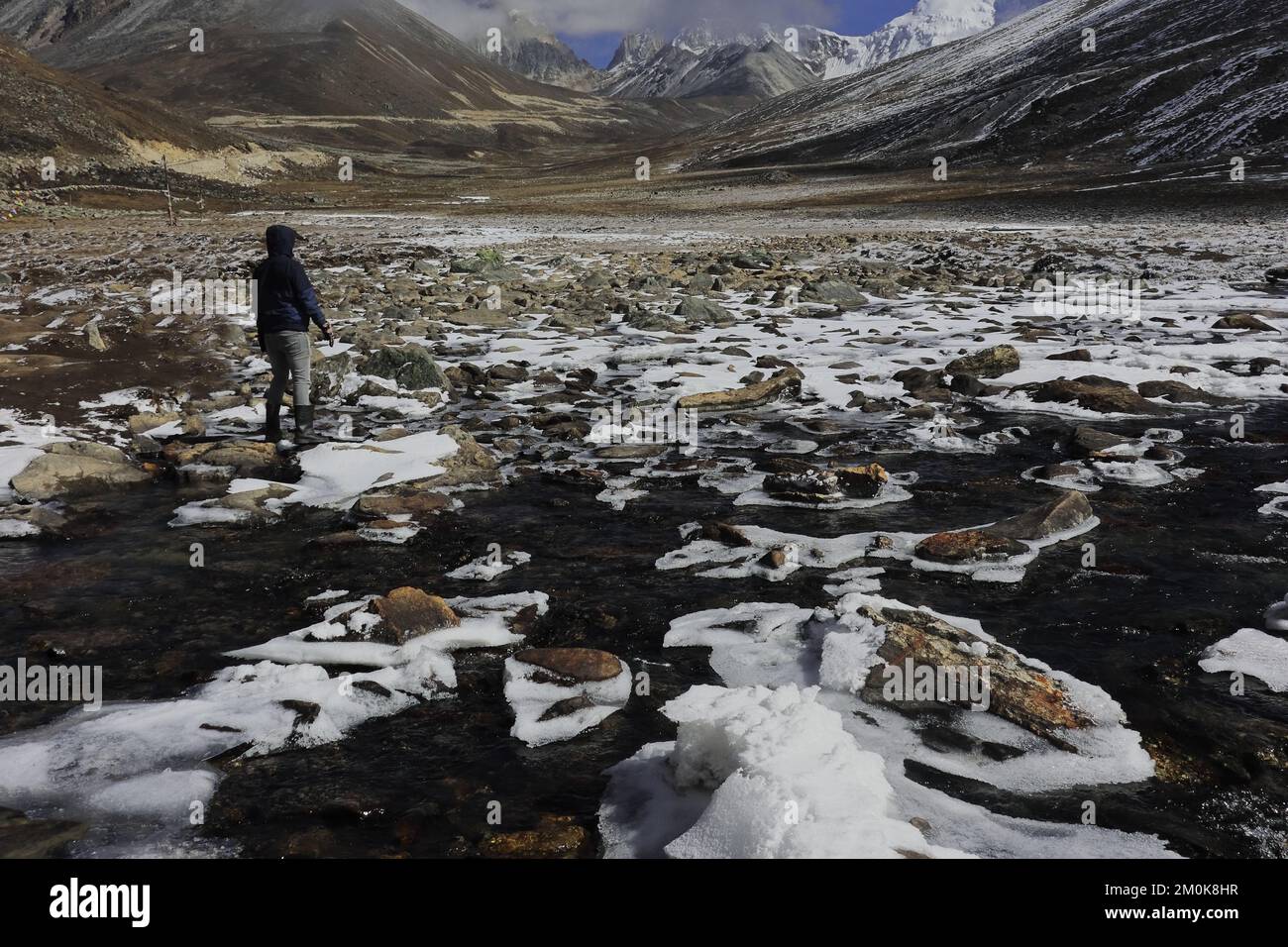 scenic mountain landscape, frozen stream and alpine valley of zero ...