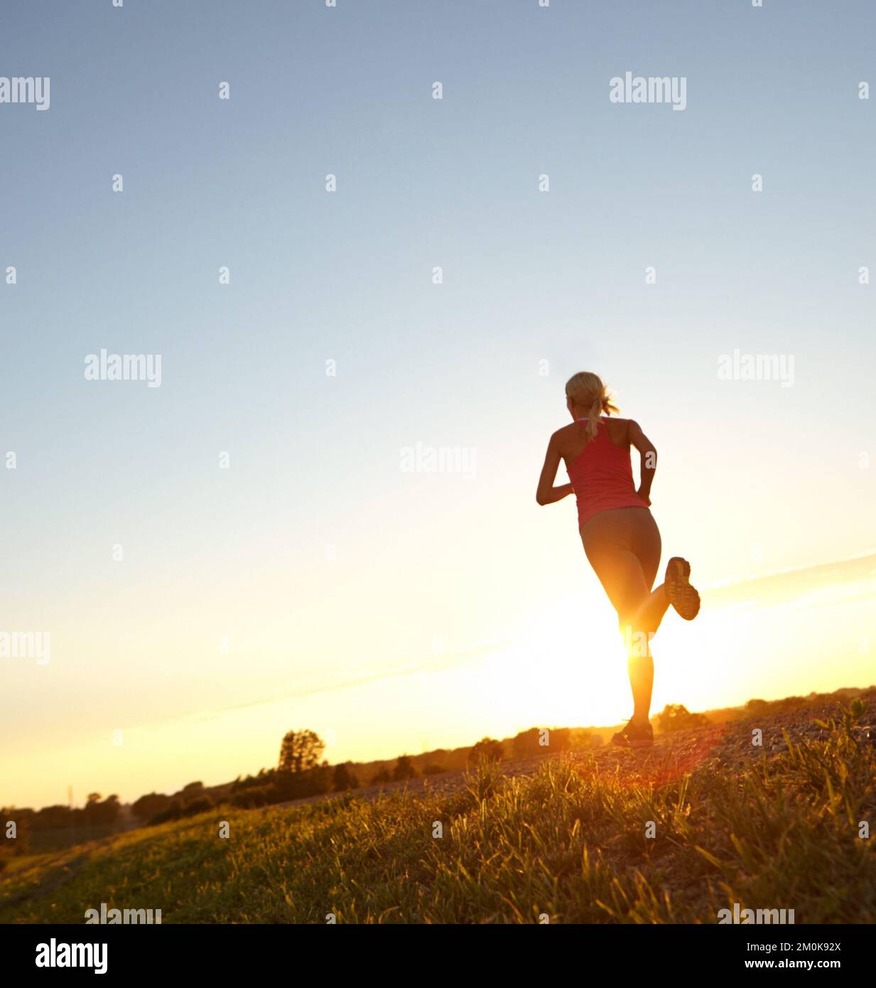 Woman jogging low angle hi-res stock photography and images - Alamy