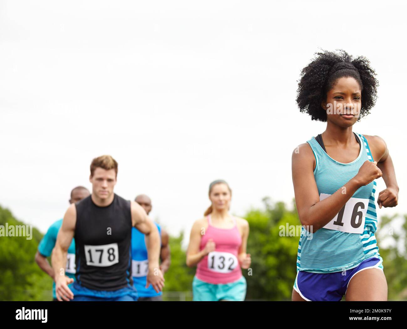 Getting ahead of the other women. a persistent female athlete running ...