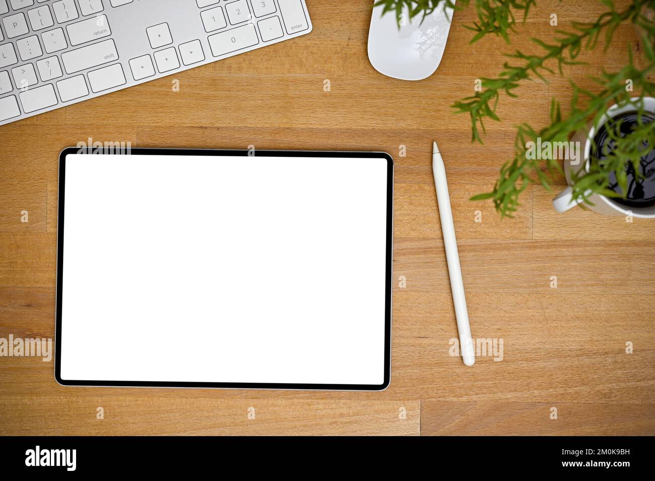 Top view workspace with blank screen tablet on wooden table with coffee ...