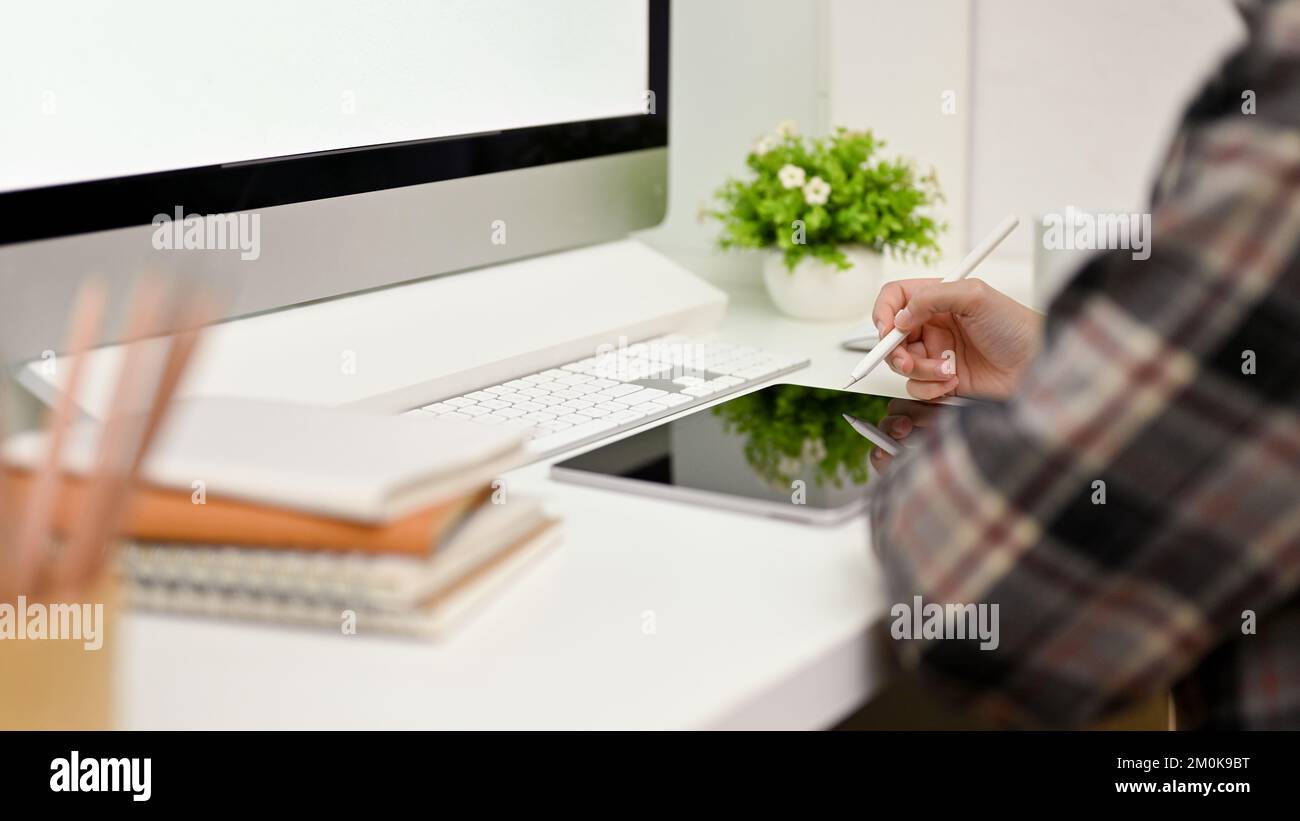 cropped shot, A female graphic designer using her digital tablet ...