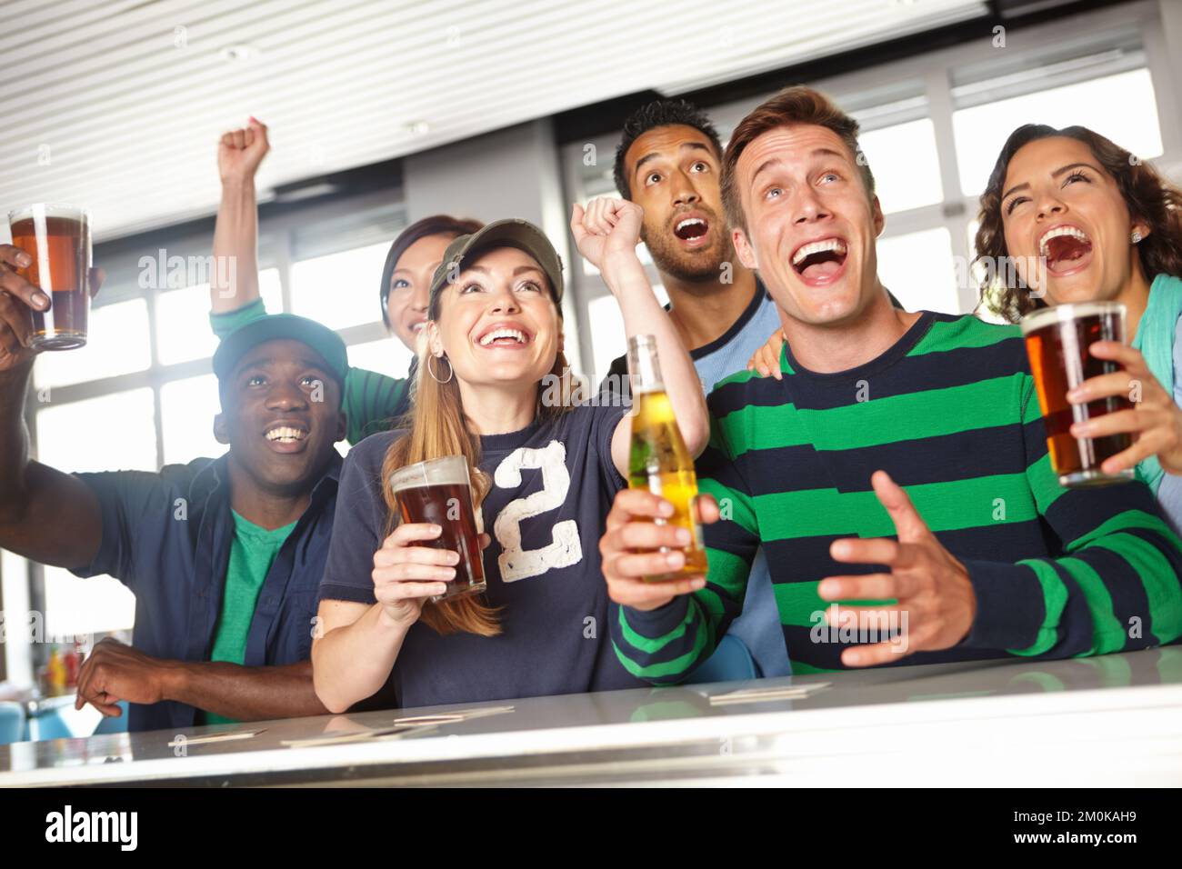 Youre nearly there Go Come on. A group of friends cheering on their ...