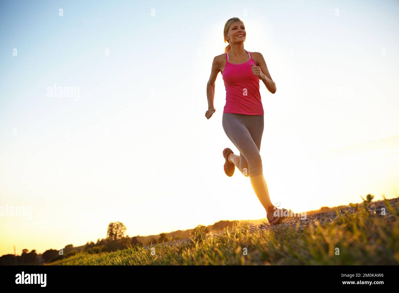 Woman jogging low angle hi-res stock photography and images - Alamy