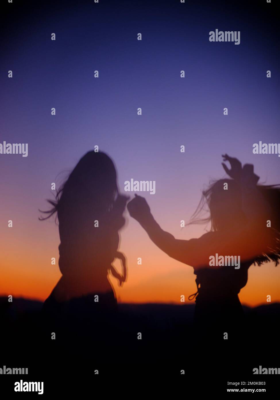 two friends party dancing till late night, with joy and freedom during ...