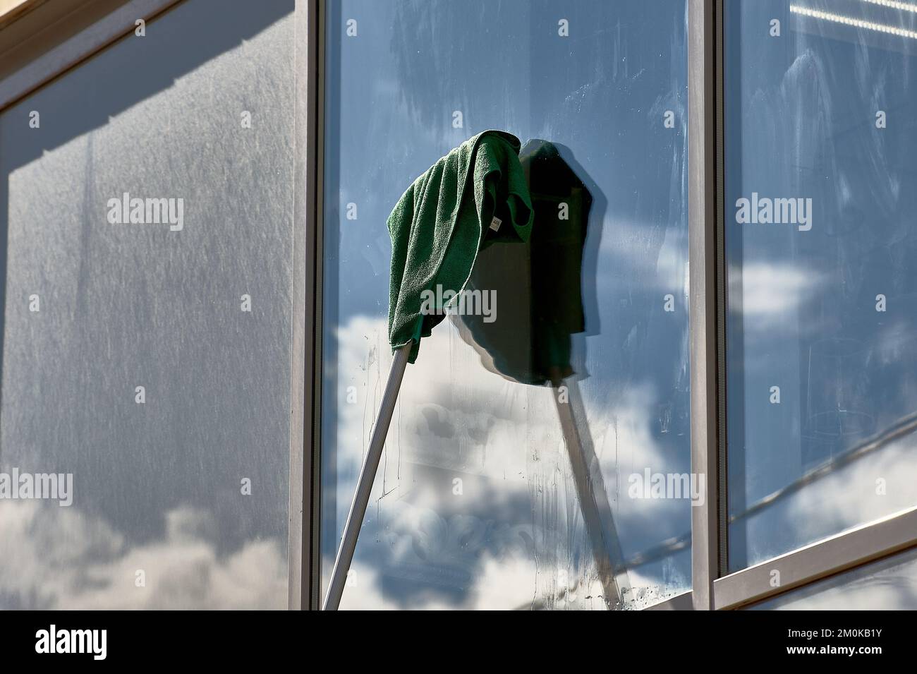 window washing, washing a street shop window Stock Photo - Alamy