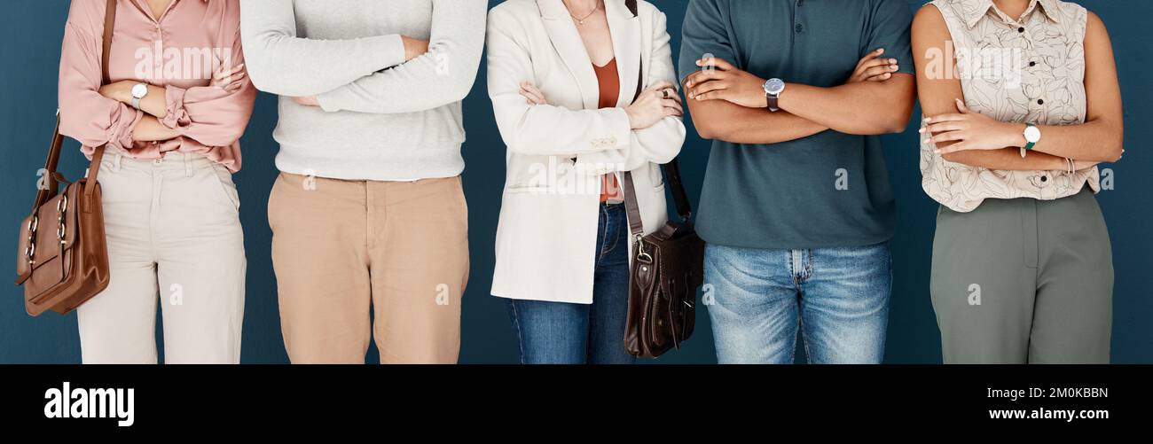 Group of businesspeople standing in a line in an office together. Five ...