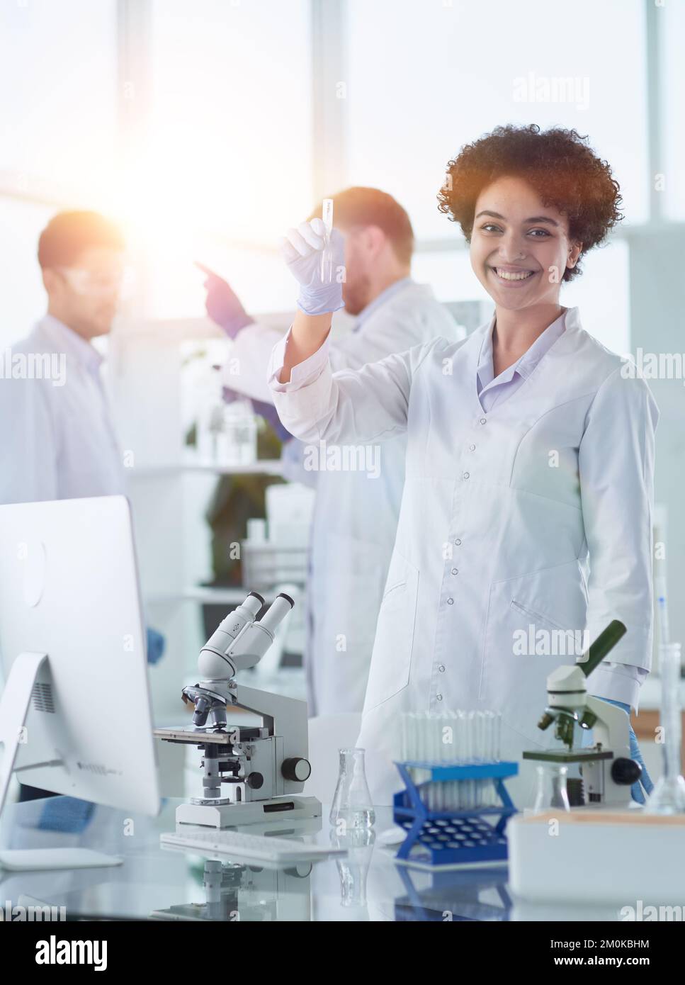 Smiling scientists looking at camera arms crossed in laboratory Stock ...