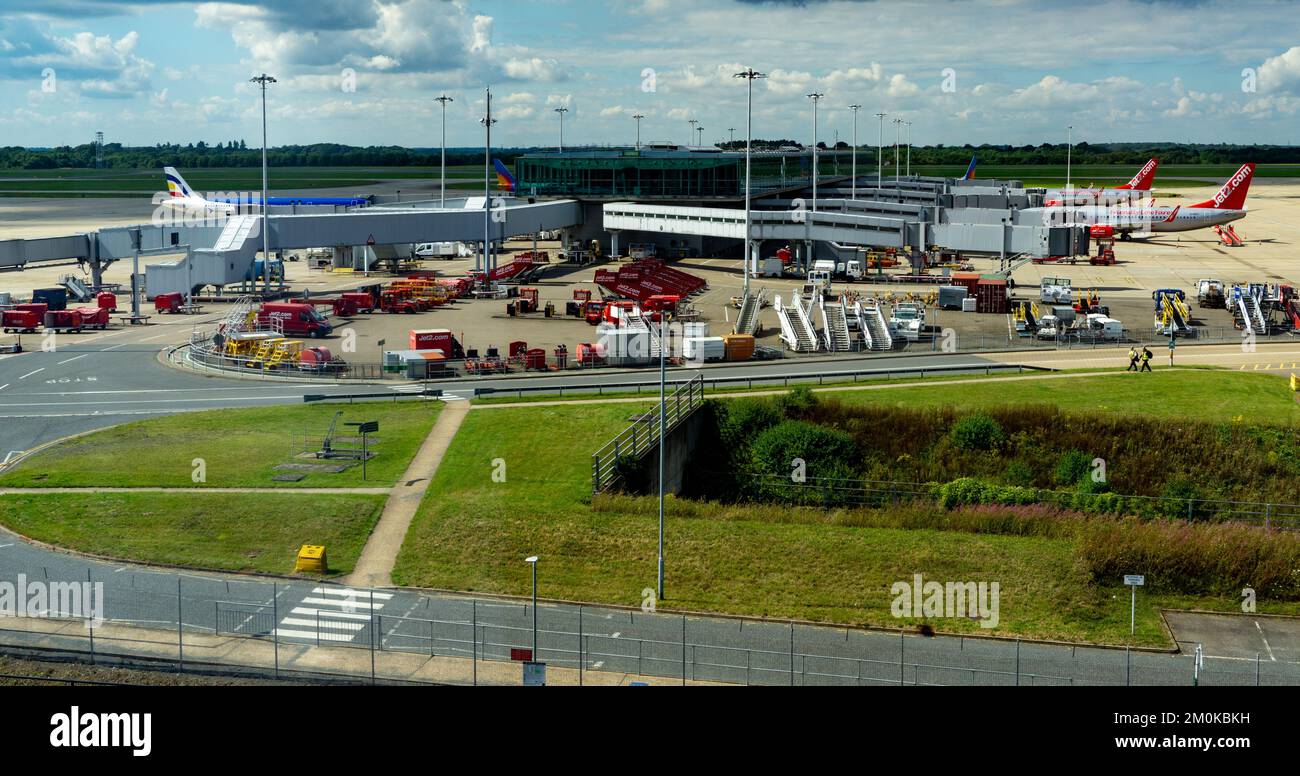 Passenger planes at Stansted Airport in the loading area and runway in ...