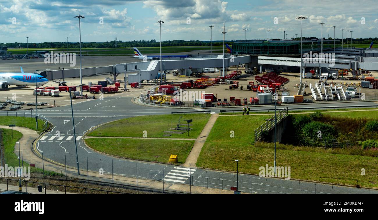 Passenger planes at Stansted Airport in the loading area and runway in ...