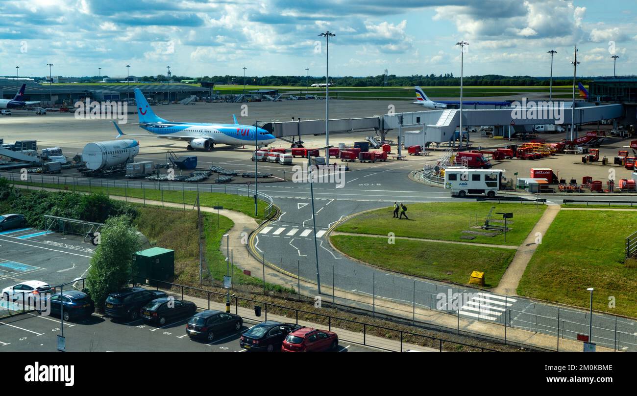 Passenger planes at Stansted Airport in the loading area and runway in ...