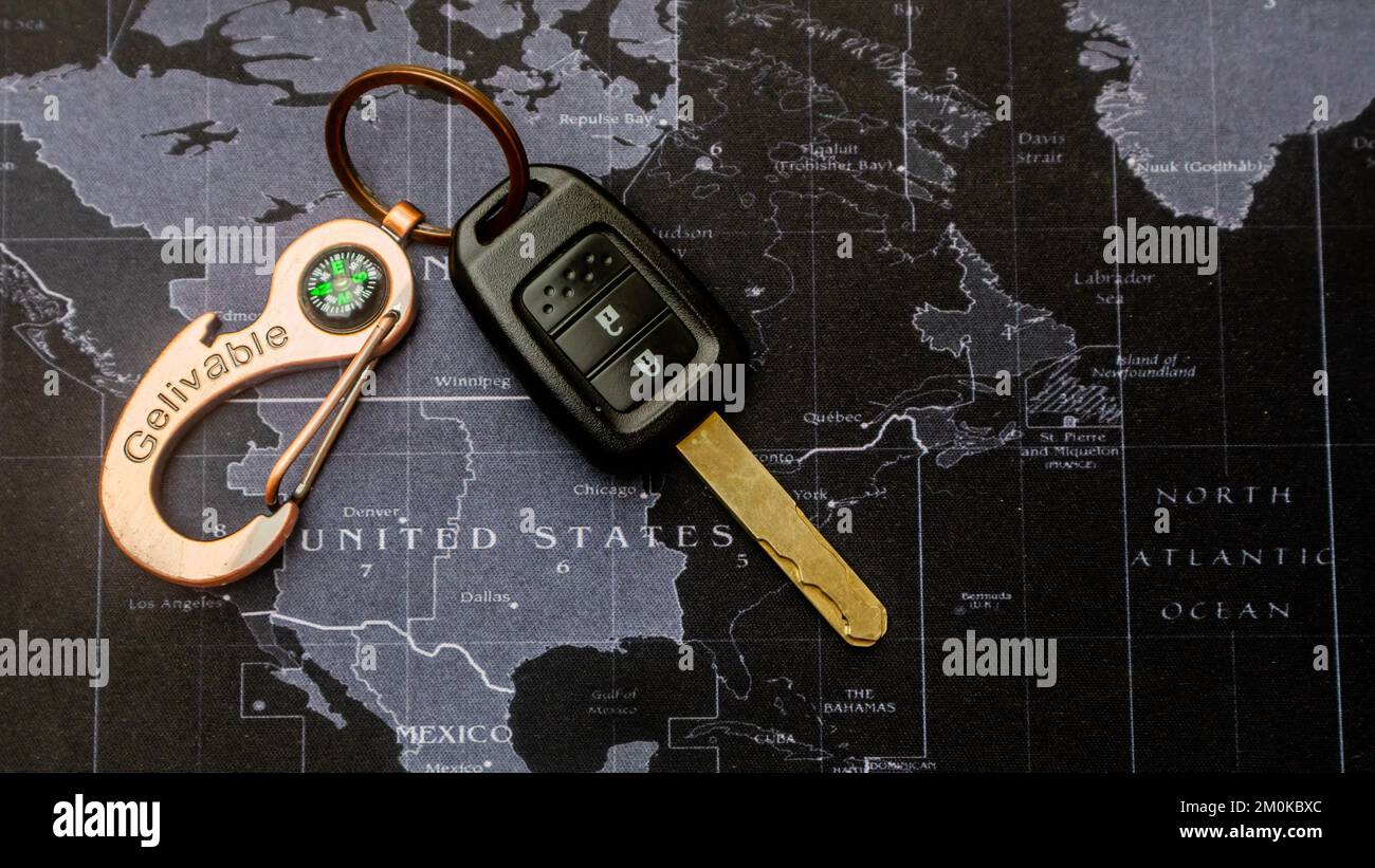 black car key over black map Stock Photo - Alamy