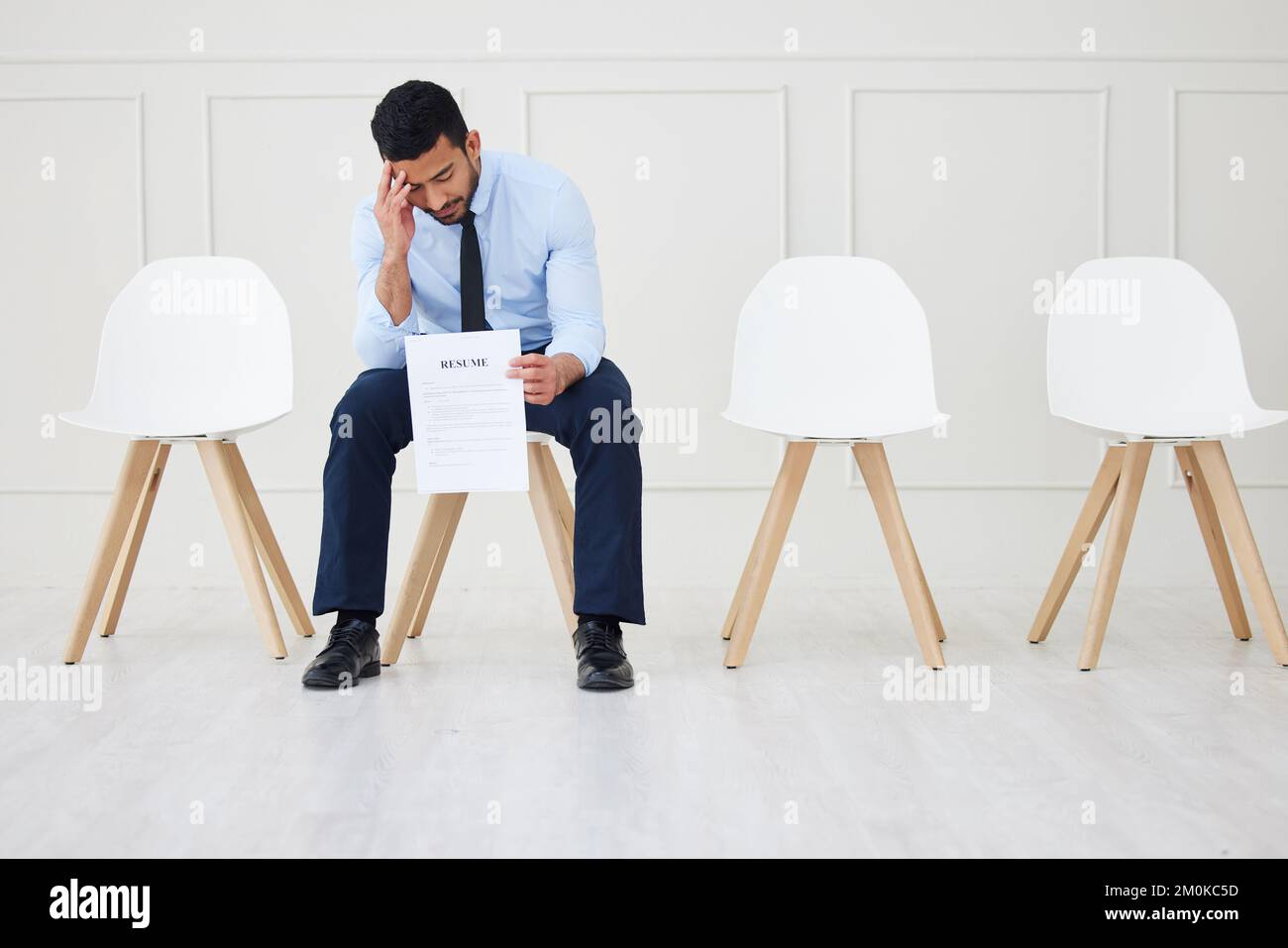 Full length of asian businessman waiting for an interview. One young ...