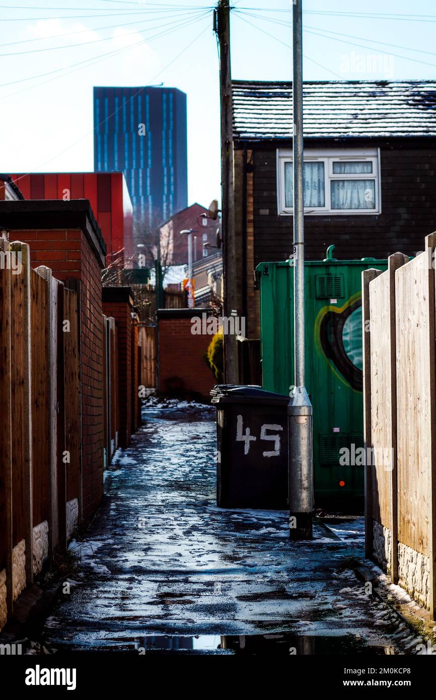 A vertical shot of a narrow back-end alleyway in an urban area Stock ...